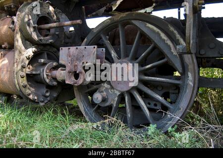 Old dysfunctional railway steam locomotive which is overgrown with ...