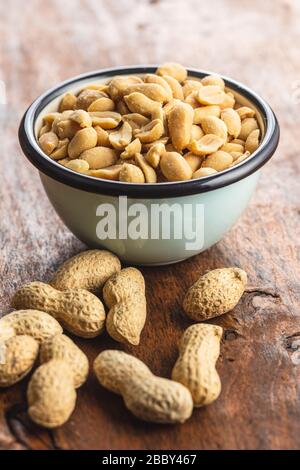 salted roasted peanuts on wooden background Stock Photo - Alamy