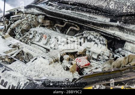 Washing car engine. Car wash service before and after washing. Before ...