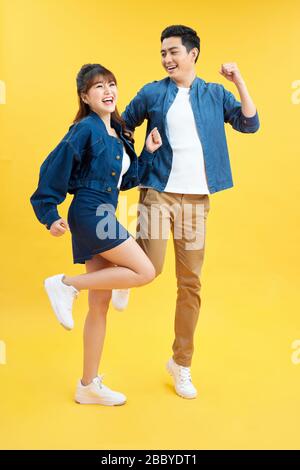 Full body photo of excited attractive lady sit floor arms hold show ...