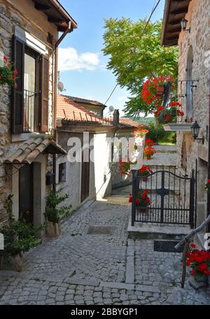 A narrow street between the houses of Scontrone, a village in the ...