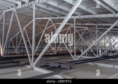 V- shaped metal pillars as construction under roof of building Stock ...