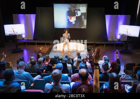 Speaker answering the questions of audience on business conference in ...