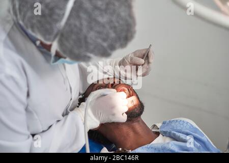african woman cleaning teeth with dental floss Stock Photo - Alamy