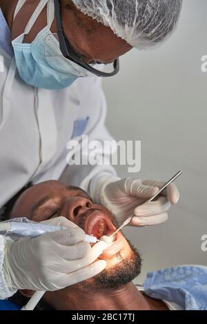 african woman cleaning teeth with dental floss Stock Photo - Alamy