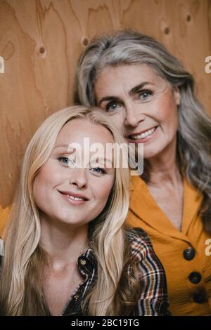 Portrait of smiling mother and adult daughter in park Stock Photo - Alamy