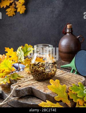 Alcohol and oak bark in a glass jar - preparation of herbal tincture ...