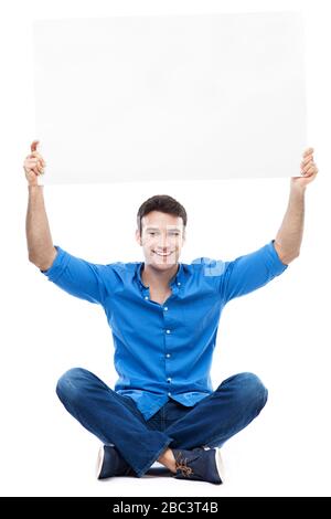 Business people smiling while holding a poster Stock Photo - Alamy