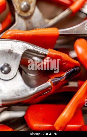 Closeup of orange handled spring clamps Stock Photo - Alamy