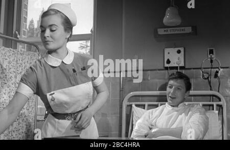 London. UK. Shirley Eaton and Terence Longdon in a scene in ...
