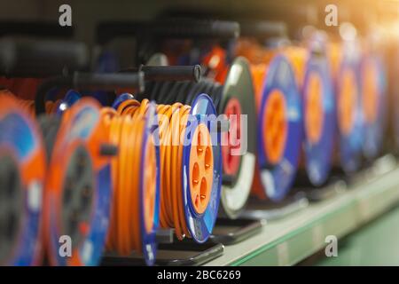 Long extension cords roll with european plug outlet Stock Photo - Alamy