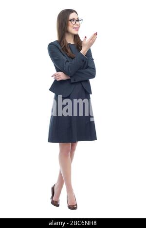 Young adult businesswoman smiling, standing confidently with arms ...