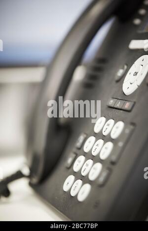 Closeup of landline phone on desk in modern office Stock Photo - Alamy