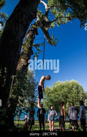body piercing hanging at the lake Stock Photo - Alamy