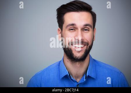 Studio shot of young handsome businessman with pink shirt Stock Photo ...