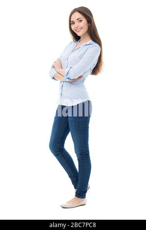 Young adult woman over white brick wall wearing winter outfit at home ...