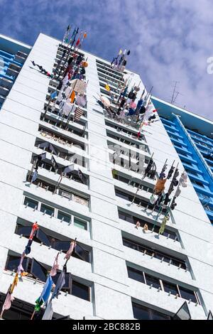 drying laundry hanging from poles at HDB flats in Singapore Stock Photo ...