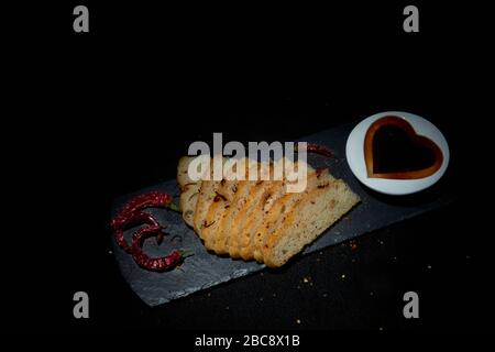 A low-key shot of the heart shape Christmas light decorations on a dark ...