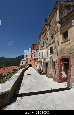 A narrow street between the houses of Scapoli, a village in the Molise ...