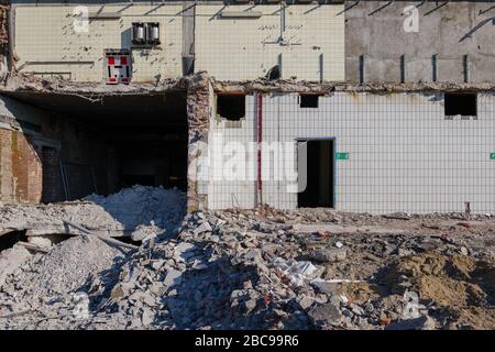 Side view of existing brick and tile wall, door and ruin of tile and ...