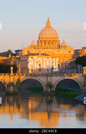 Saint Peter"s Basilica and the Santangelo bridge in the golden eveing ...