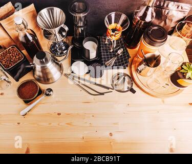 Accessories and utensils for making coffee drinks on a wooden table ...
