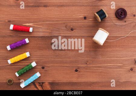 Set of sewing supplies with thread spools on yellow background Stock ...