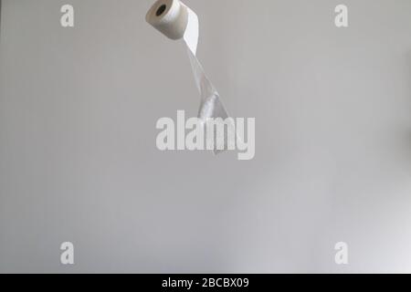 artistic concept shot of flying toilet paper roll Stock Photo - Alamy
