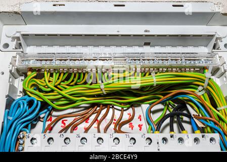 Block connecting green-yellow grounding wires with connected cables ...