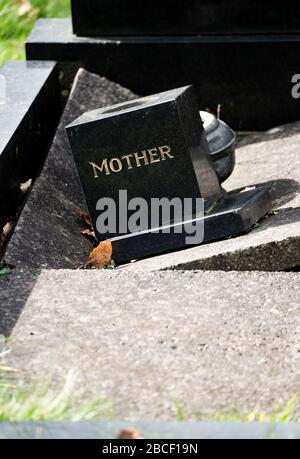 Damaged and neglected grave Stock Photo - Alamy