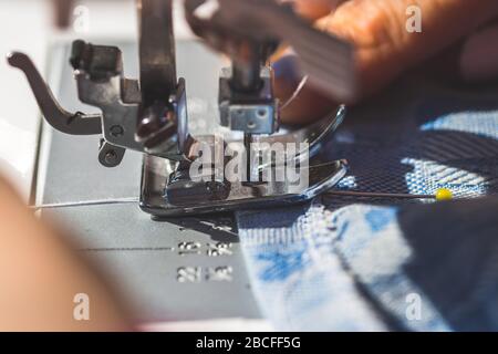 Close up of sewer working with textile and sewing needle Stock Photo ...