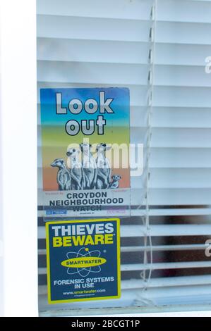 Neighborhood watch stickers on doors and windows Stock Photo - Alamy