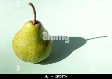 Pear fruit with a shadow Stock Photo - Alamy