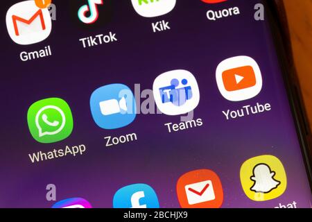 A closeup of the logos for the Zoom and Microsoft Teams video ...