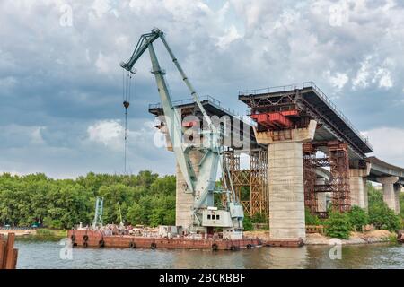 Building Preobrazhensky bridge across the Dnieper River to the island ...