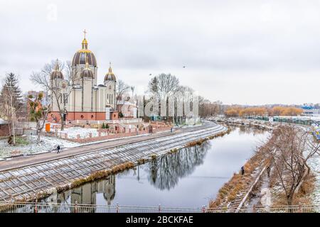 Rivne, Ukraine - January 4, 2020: Ukrainian Rovno city with parking lot ...
