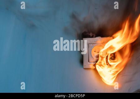 White circuit breaker damaged by burning and overheating, indicating ...
