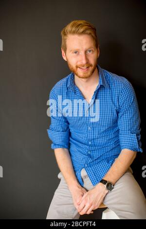 Photo of young redhair beard mustache man good hairstyle touch chin ...