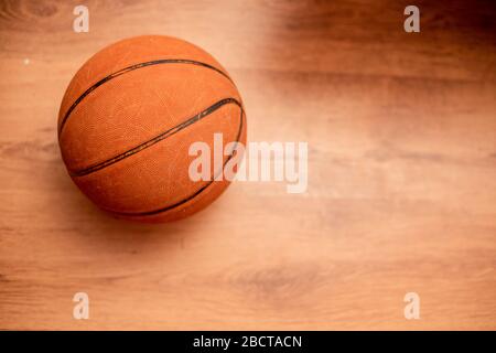 Basketball on wooden floor shot from high angle Stock Photo - Alamy