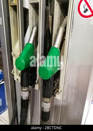 Fuel pump stand with pistol - nozzle, vehicles drive past Stock Photo ...