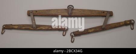 A doubletree harness consisting of a wood evener bar (central piece ...