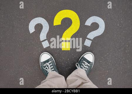 Shoes, trainers - question marks Stock Photo - Alamy