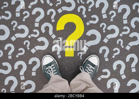 Shoes, trainers - question marks Stock Photo - Alamy