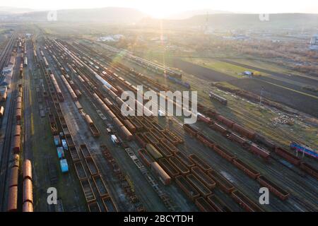 Aerial view of various railway carriage trains with goods on the ...