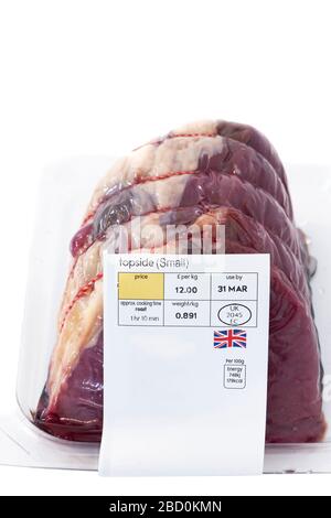Raw topside of beef in plastic packaging with a food label sticker on ...