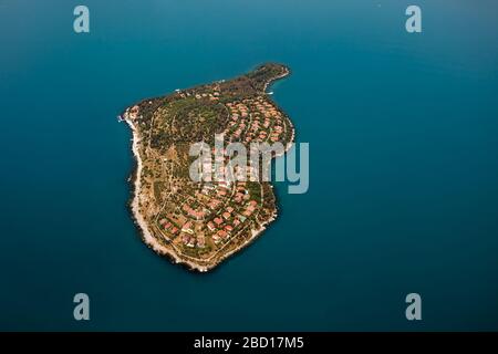 Aerial view of Sedef Island (Mother of Pearl Island) framed by green ...