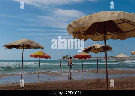 Chekka, Lebanon - May 19, 2017: Couples enjoy dipping in the sea waters ...