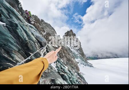 Mountain Climber Pointing Direction Stock Photo - Alamy
