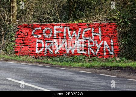 Cofiwch Dryweryn Remember Tryweryn graffiti on old wall Llanrhystud ...