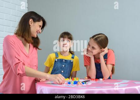 Funny face. Emotional teenager child hold gift on birthday. Funny kid ...